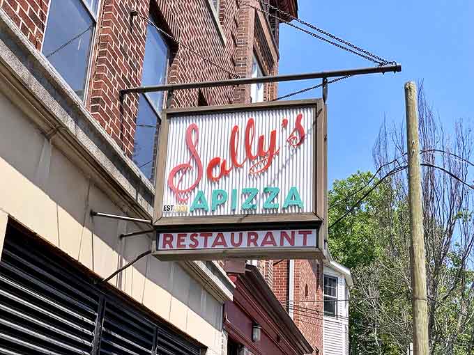 That vintage sign hanging from the brick facade isn't just advertising &ndash; it's a beacon of hope for pizza pilgrims who've made the journey to Wooster Street.