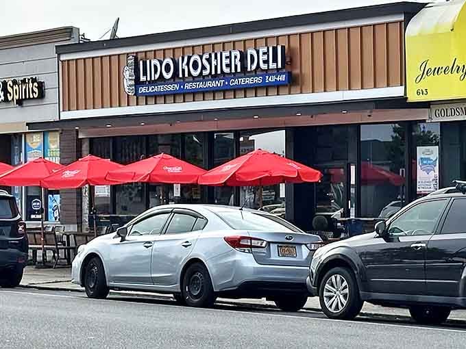 Those bright red umbrellas signal the oasis of deliciousness that awaits. The unassuming exterior hides New York's best-kept pastrami secret.