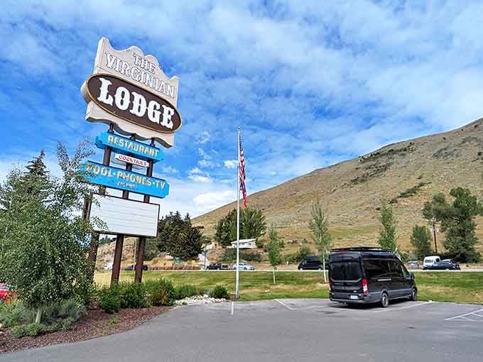 The iconic Virginian Lodge sign stands tall against Wyoming's big sky, a beacon for hungry travelers and locals alike.