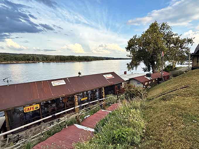 Perched right on the Mississippi like a weathered postcard come to life, the Fish Shack's rustic metal roof and screened-in dining area promise river views with every bite.