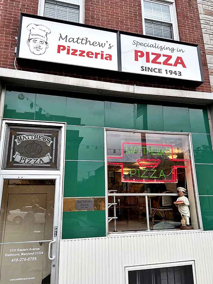 The emerald-tiled facade of Matthew's Pizzeria stands as a beacon of pizza perfection on Eastern Avenue, promising delicious traditions since 1943.