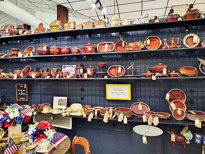 A wall of vintage pottery glows with warm amber hues, showcasing Americana that would make Martha Stewart swoon with collector's envy.