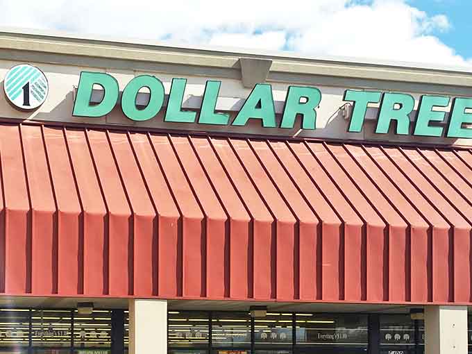 The iconic green Dollar Tree sign against a bright blue sky &ndash; where budget-friendly dreams and impulse purchases live in perfect harmony.