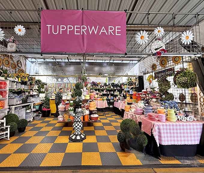 Tupperware paradise! This vibrant booth transforms plastic storage into an art form, with cheerful daisies adding a touch of whimsy to practical kitchen solutions.