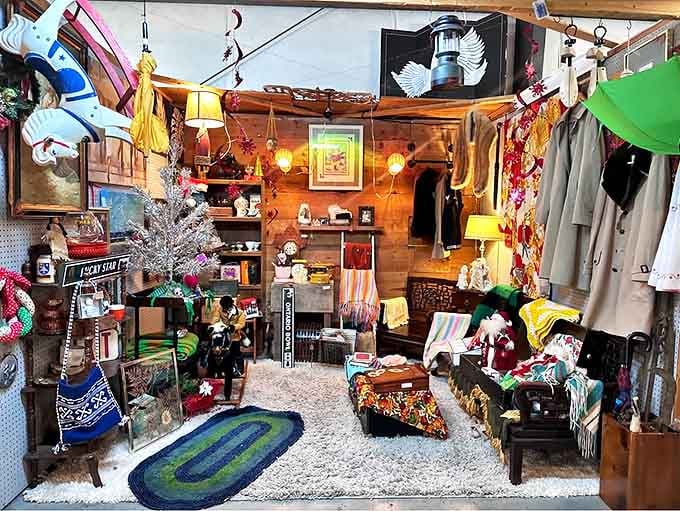 A cozy cabin-themed booth where nostalgia comes alive with vintage treasures, colorful textiles, and holiday decorations that whisper stories from decades past.
