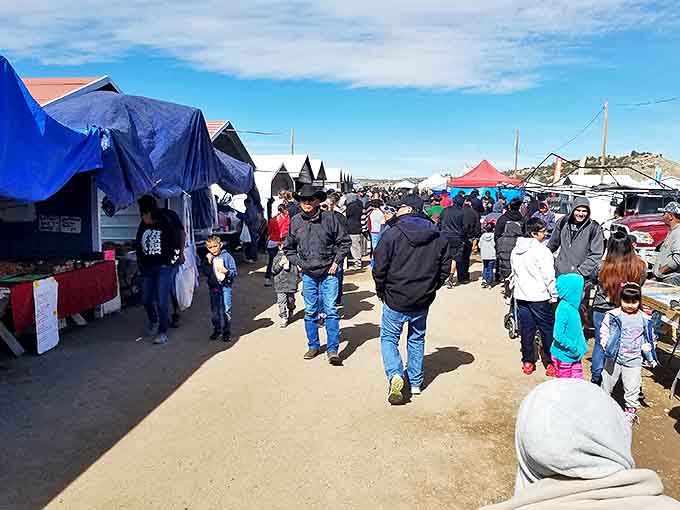 The weekend pilgrimage draws families from across New Mexico, creating a vibrant tapestry of shoppers against the desert backdrop.