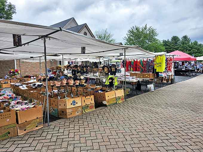 Outdoor vendors set up under white canopies, offering everything from household goods to colorful clothing—the weekend treasure hunt begins.