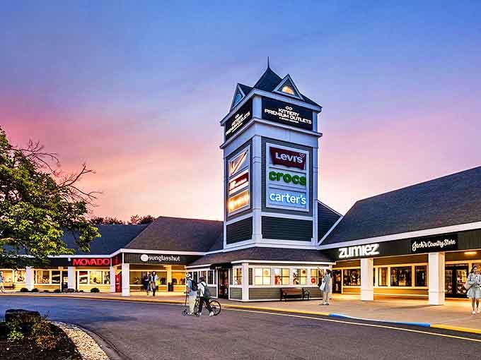 The iconic tower of Kittery Premium Outlets stands like a retail lighthouse, guiding bargain hunters safely to shore through seas of full-price merchandise.
