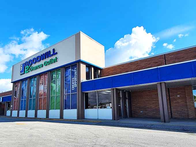 Under bright blue skies, the Goodwill Outlet stands ready for another day of rescue missions, saving perfectly good items from landfill purgatory.