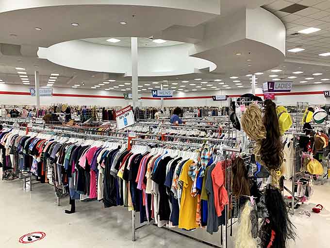 Endless racks of clothing stretch across arc's spacious floor, organized by department and color—a textile treasure hunter's paradise.