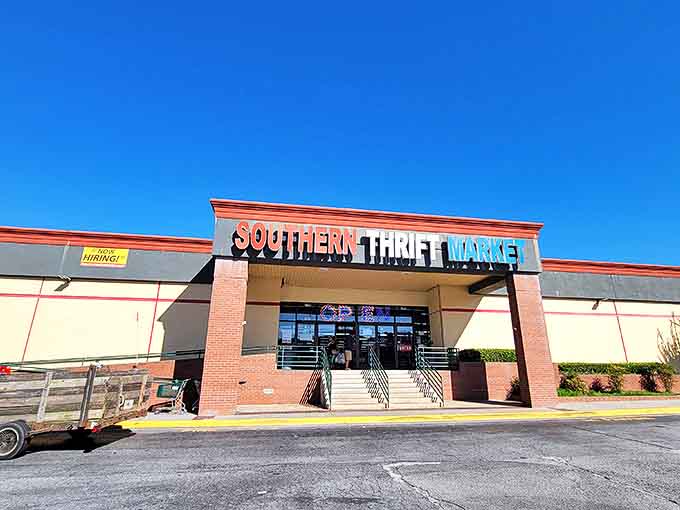 The red, white, and blue sign beckons like a patriotic promise of treasures within. Southern Thrift Market doesn't whisper about bargains—it shouts them from the rooftop.