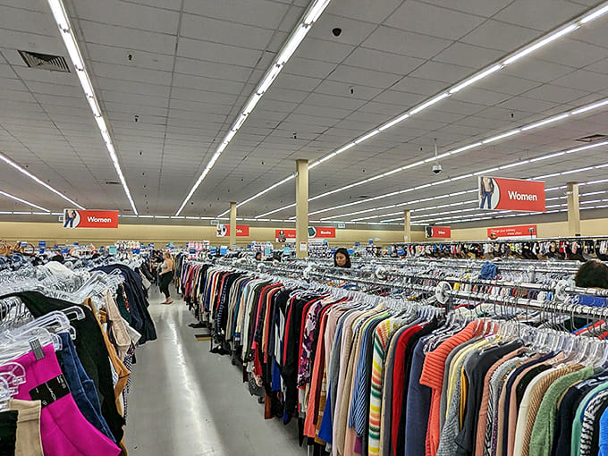 Endless racks of clothing stretch toward the horizon at Savers, where treasure hunters navigate a sea of secondhand fashion finds.