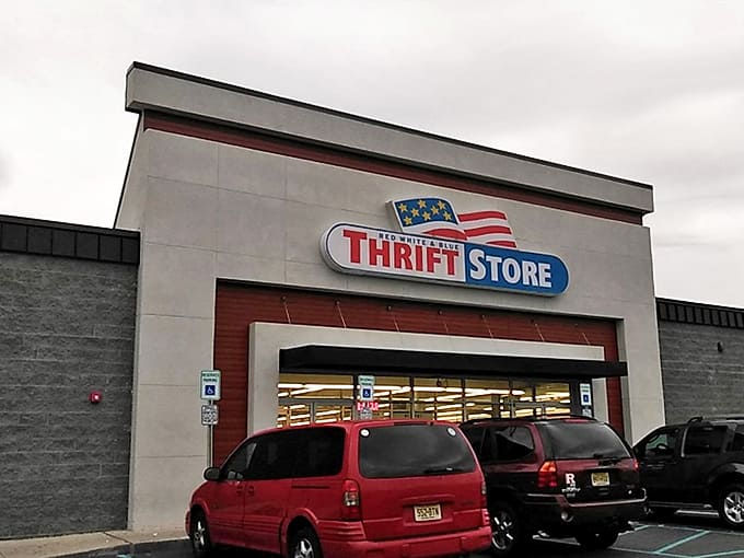 The patriotic facade of Red White & Blue beckons bargain hunters like a retail Statue of Liberty welcoming the deal-seeking masses.