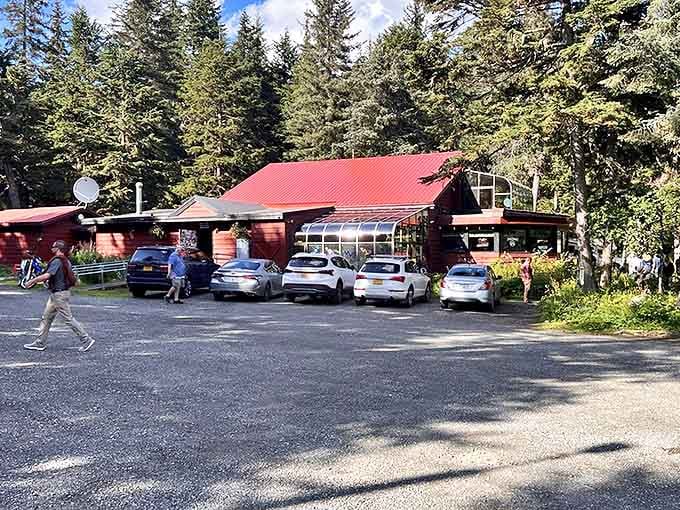 The Double Musky Inn emerges from the Alaskan wilderness like a culinary mirage, its red roof and glass solarium beckoning hungry travelers with promises of Cajun-meets-frontier cuisine.