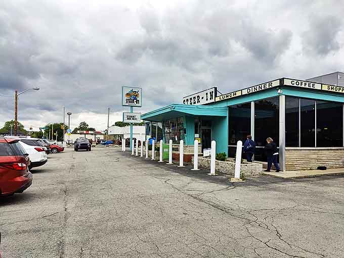 Those white bollards have protected this east side treasure for decades, standing guard like sentinels while generations of Hoosiers satisfy their burger cravings.