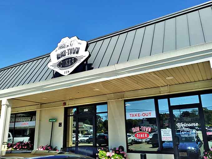 The unassuming exterior of Iron Town Diner in Saugus – where breakfast dreams come true beneath that classic diner signage.