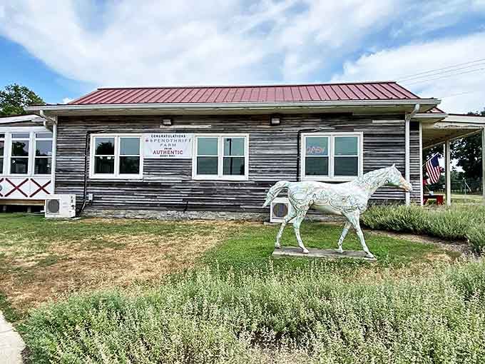 The weathered wooden exterior and distinctive red roof of Windy Corner Market whisper "authentic Kentucky" before you even step inside.