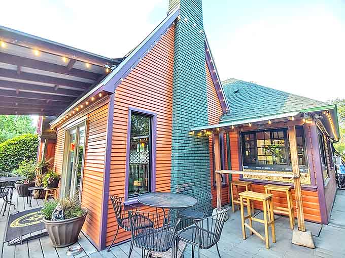 Warm wood siding and a teal chimney create a fairytale-meets-craftsman vibe that practically whispers, "Come in, the coffee's better than your kitchen's."