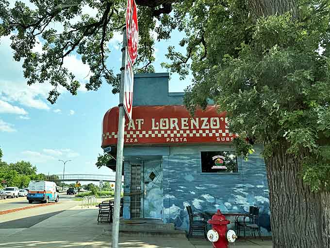 That iconic orange awning against blue walls isn't just eye-catching—it's a beacon of pizza promise that's been guiding hungry Minneapolitans through snowstorms for decades.