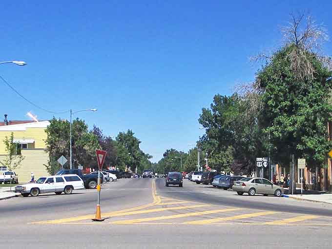 Main Street Choteau welcomes you with classic Americana charm &ndash; highway signs, fire hydrants, and flags that practically whisper "slow down and stay awhile."