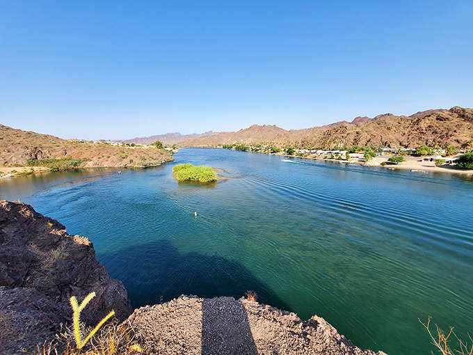 Where rugged mountains meet tranquil waters, River Island State Park creates nature's perfect contradiction. Desert peaks reflect in the Colorado River's blue mirror.