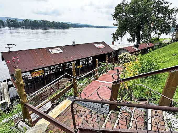 Perched right on the Mississippi like a weathered postcard come to life, the Fish Shack's rustic metal roof and screened-in dining area promise river views with every bite.