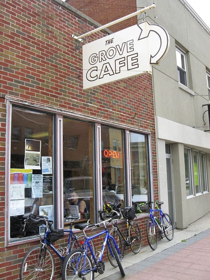 Even cyclists make the pilgrimage to The Grove Cafe, where that iconic sign promises breakfast worth pedaling for.