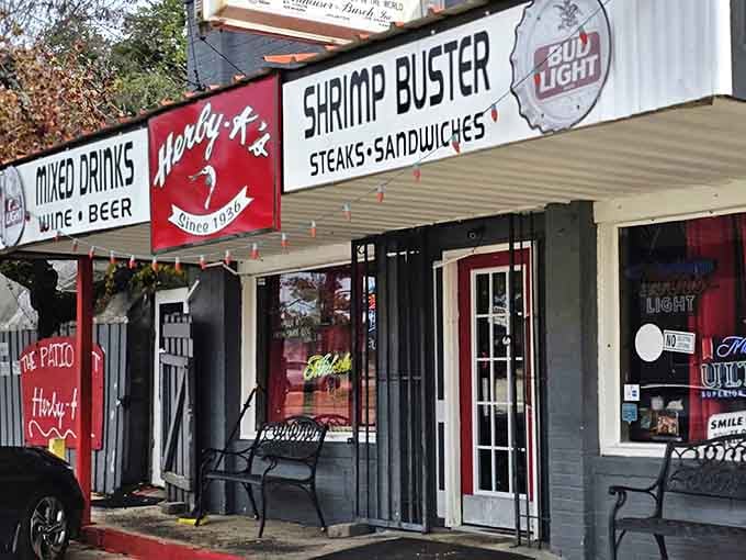 The unassuming exterior of Herby-K's promises what Vegas billboards can't deliver – authentic flavor and zero pretension. That "Shrimp Buster" sign isn't just advertising; it's a beacon of deliciousness.