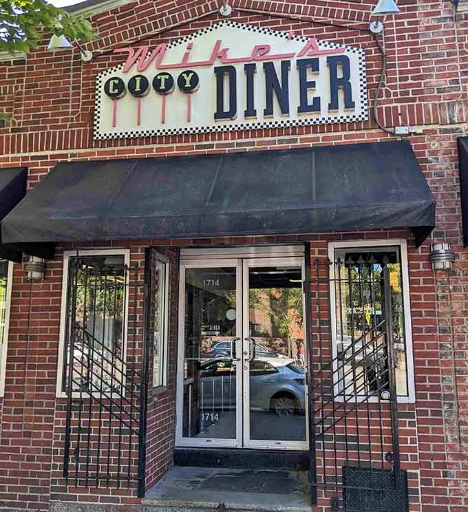 That classic checkered border framing "Mike's City Diner" isn't just decoration&mdash;it's a promise of the no-nonsense deliciousness waiting inside this South End institution.