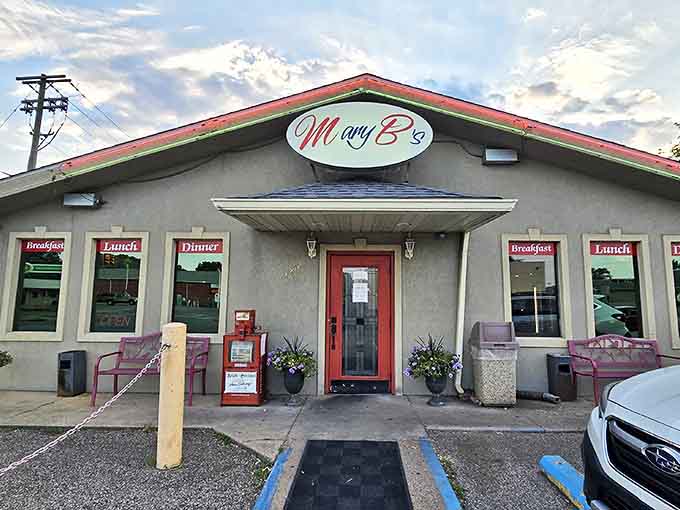 The unassuming exterior of Mary B's Diner beckons with its cheerful red door and classic signage—proof that culinary treasures often hide in plain sight.