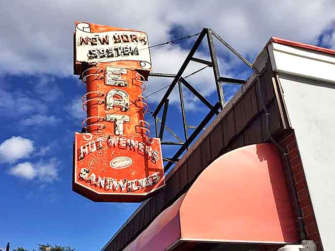 The vintage sign proudly proclaims "EAT" in bold letters &ndash; the most straightforward and honest advertising in America.