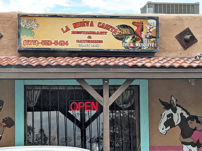 The turquoise-trimmed exterior of La Nueva Casita beckons like a desert oasis, complete with colorful murals that tell you authenticity awaits inside.