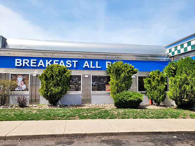The classic '50s diner silhouette of Virg's stands proudly against Utah's blue sky, its red neon sign a beacon for hungry travelers seeking comfort food salvation.