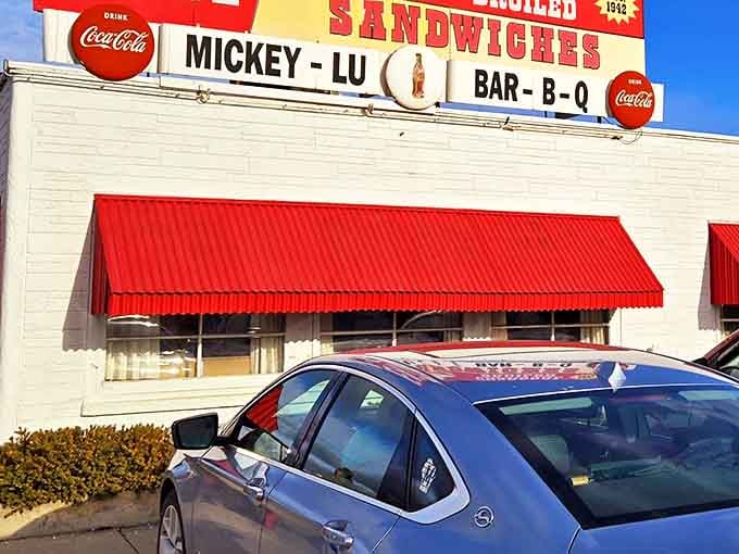 The iconic Mickey-Lu Bar-B-Q sign has been beckoning hungry travelers since the 1940s. That "EAT" command isn't a suggestion&mdash;it's the best advice you'll get all day.