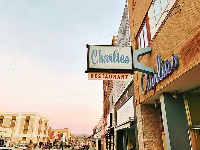 That iconic blue script against brick isn't just a sign&mdash;it's a beacon of hope for hungry souls wandering downtown Minot.