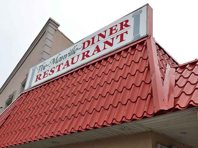 The iconic red roof of Manville Diner beckons hungry travelers like a lighthouse guiding ships to safe harbor. Classic Jersey diner architecture at its finest.