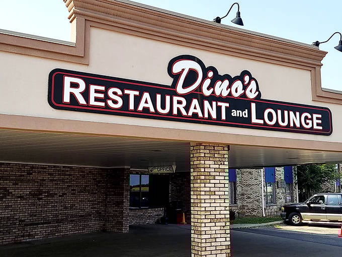 The iconic red signage of Dino's stands as a beacon of hope for hungry travelers and budget-conscious locals alike.