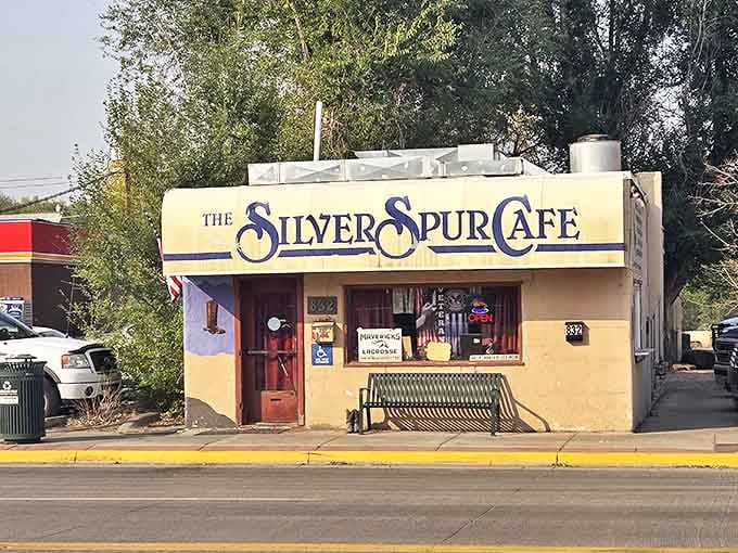 The little yellow building that could! Complete with the green bench that invites you to sit a spell before or after your meal.