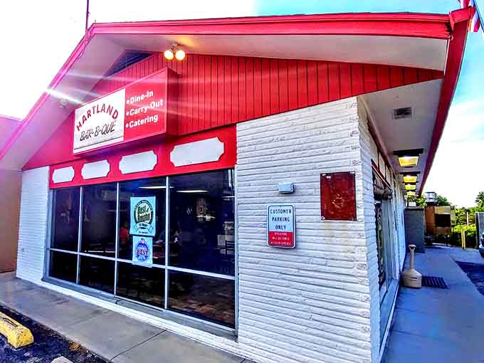 That iconic red roof signals barbecue salvation ahead. Hartland's modest exterior hides smoky treasures that have kept Omaha coming back for generations.