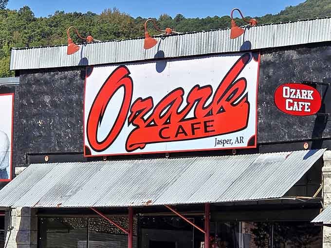 The iconic red signage of Ozark Cafe stands out like a beacon of hope for hungry travelers. Vintage charm meets mountain hospitality under that corrugated metal awning.