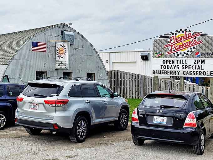 The American flag proudly displays above this curved-roof culinary institution, while the parking lot tells the real story&mdash;locals know exactly where to find breakfast nirvana.