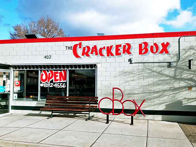 The iconic red lettering against white brick announces your arrival at diner paradise &ndash; like a beacon of breakfast hope on a hungry morning.