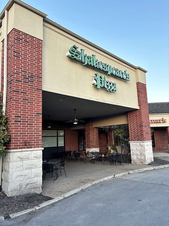The iconic green glow of Shakespeare's Pizza sign welcomes hungry visitors like a beacon of cheesy hope in Columbia's culinary landscape.