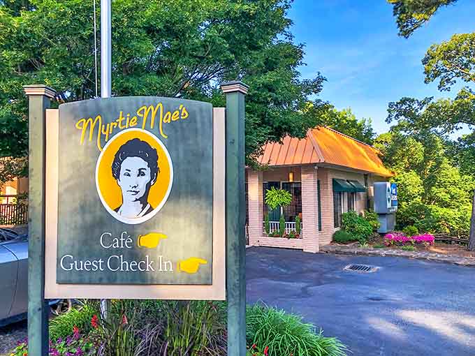 The welcoming sign at Myrtie Mae's promises comfort food salvation after a day of exploring Eureka Springs' winding streets.