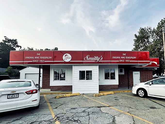 The red awning beckons like a lighthouse for hungry souls. Smitty's modest exterior hides culinary treasures that have made it an Iowa institution.