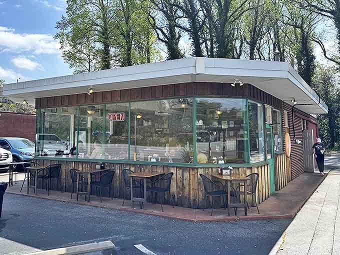 Henry's unpretentious exterior features weathered wood panels and glass-enclosed seating&mdash;where barbecue magic happens without fancy frills or elaborate marketing.