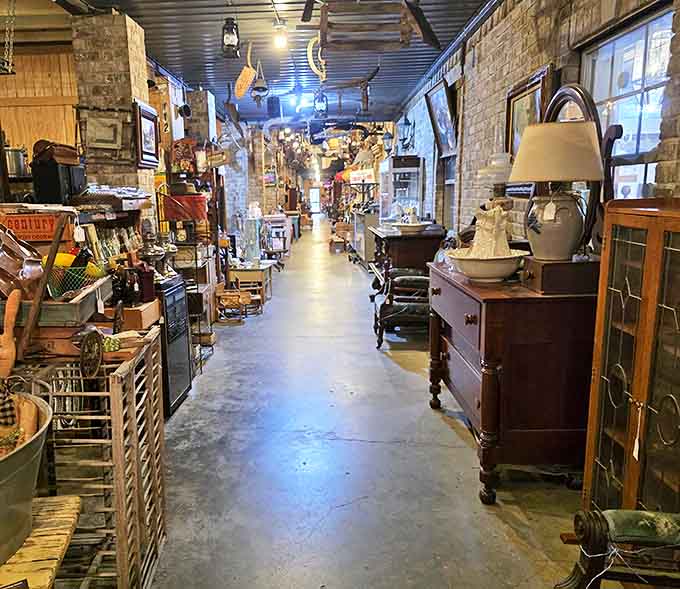Long corridors of possibility stretch before you, where exposed brick walls and concrete floors frame treasures waiting to be discovered. Every aisle tells a different story.