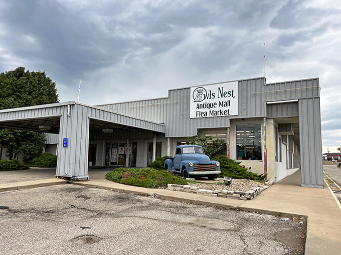The iconic blue Chevy pickup isn't just decoration&mdash;it's a time machine parked outside, promising vintage treasures await within these metal walls.