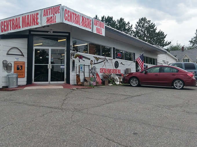 Patriotic flair greets visitors at Central Maine Antique Mall's entrance, where vintage finds await just beyond those glass doors.