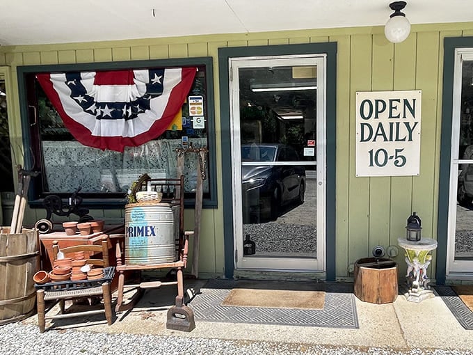Patriotic bunting welcomes treasure hunters to Northwood Antique & Collectible Center, where vintage finds spill onto the welcoming porch daily.